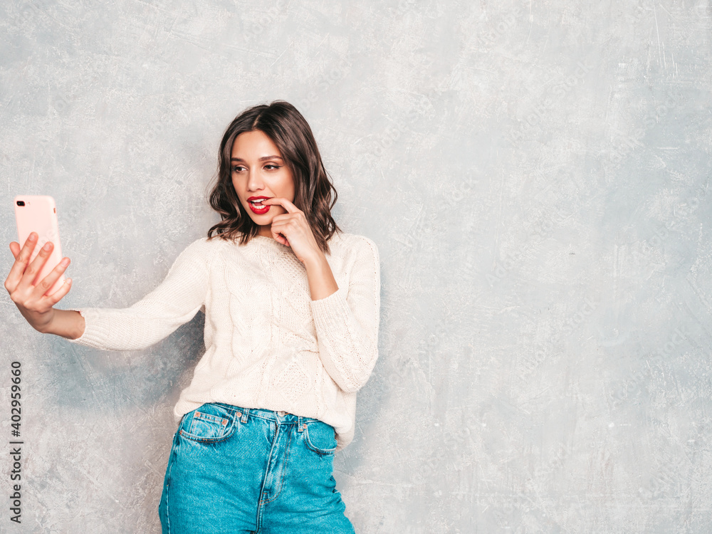 Young beautiful woman taking selfie photos. Trendy smiling model in ...