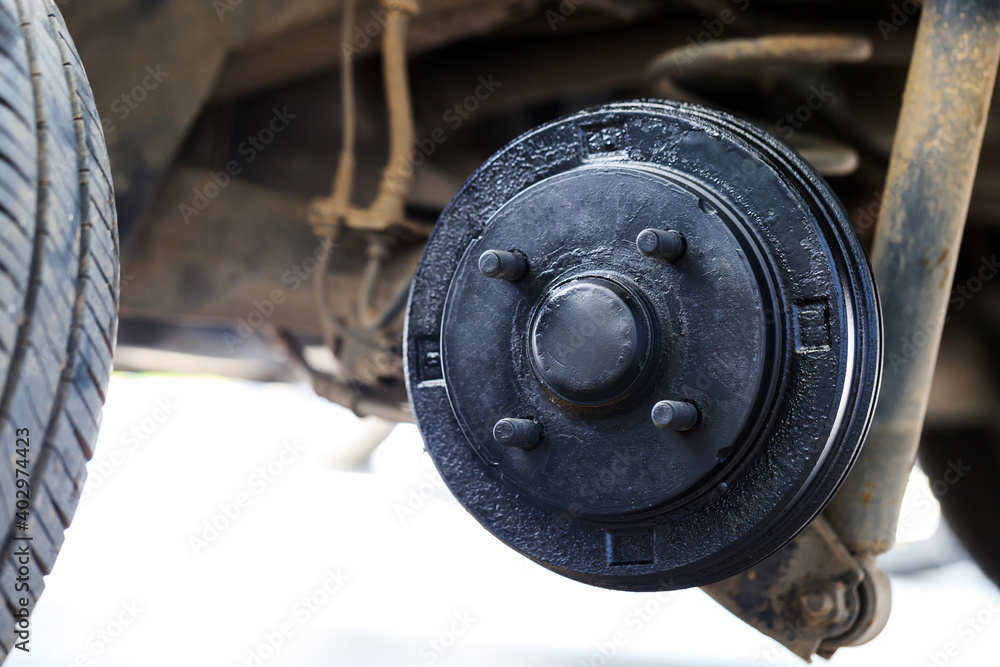A rear hub of the car after removing a tire and wheel, maintaining a ...