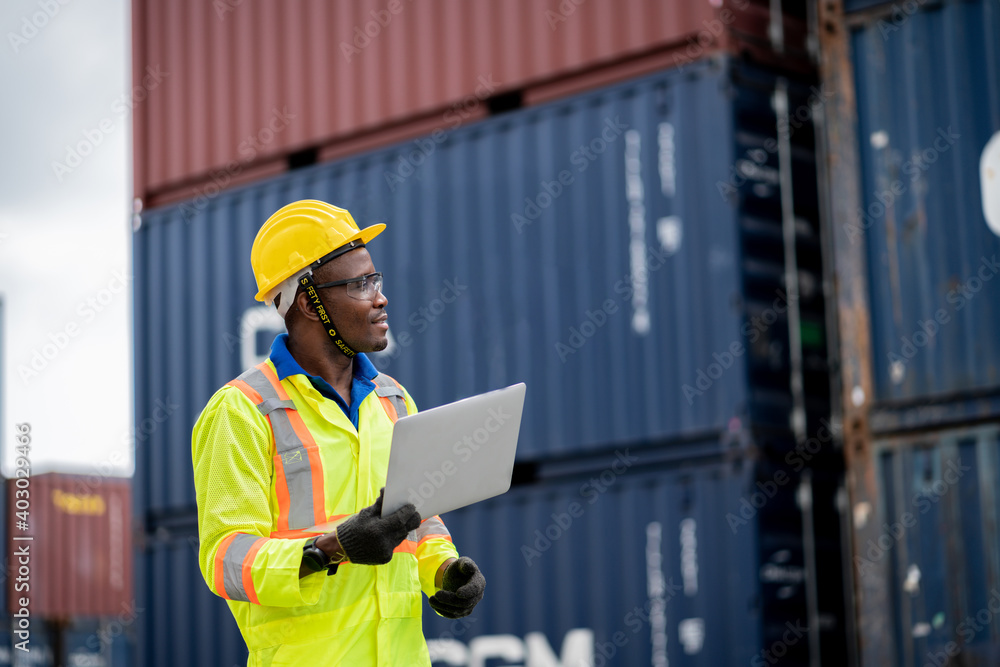 engineer man / worker in safety jumpsuit uniform with yellow hardhat ...