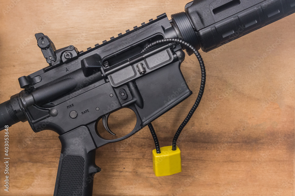 AR-15 semi-auto assault rifle gun on a wooden background unloaded and ...