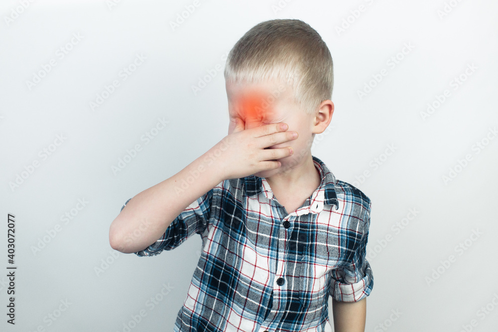 An ophthalmologist examines a boy who complains of burning and pain in ...