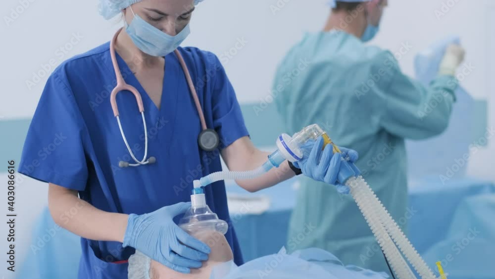 Girl's hand with a pulse oximeter in the operating room. Modern medical ...