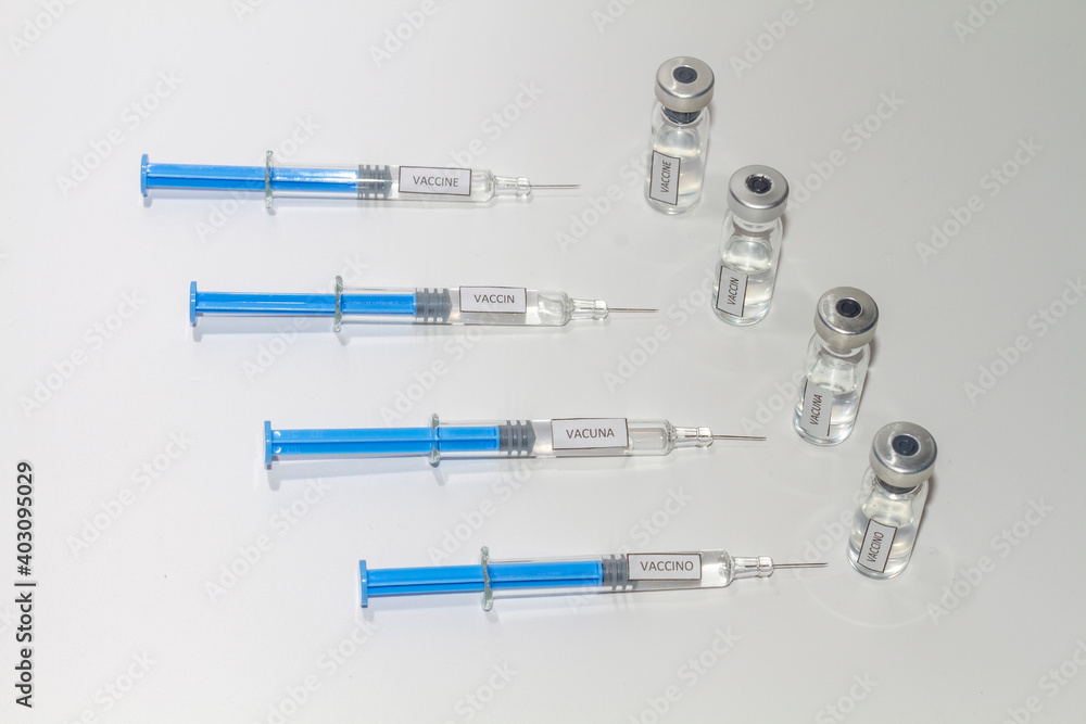 Covid-19. Five vials and five syringes of vaccine ready to inject. The ...