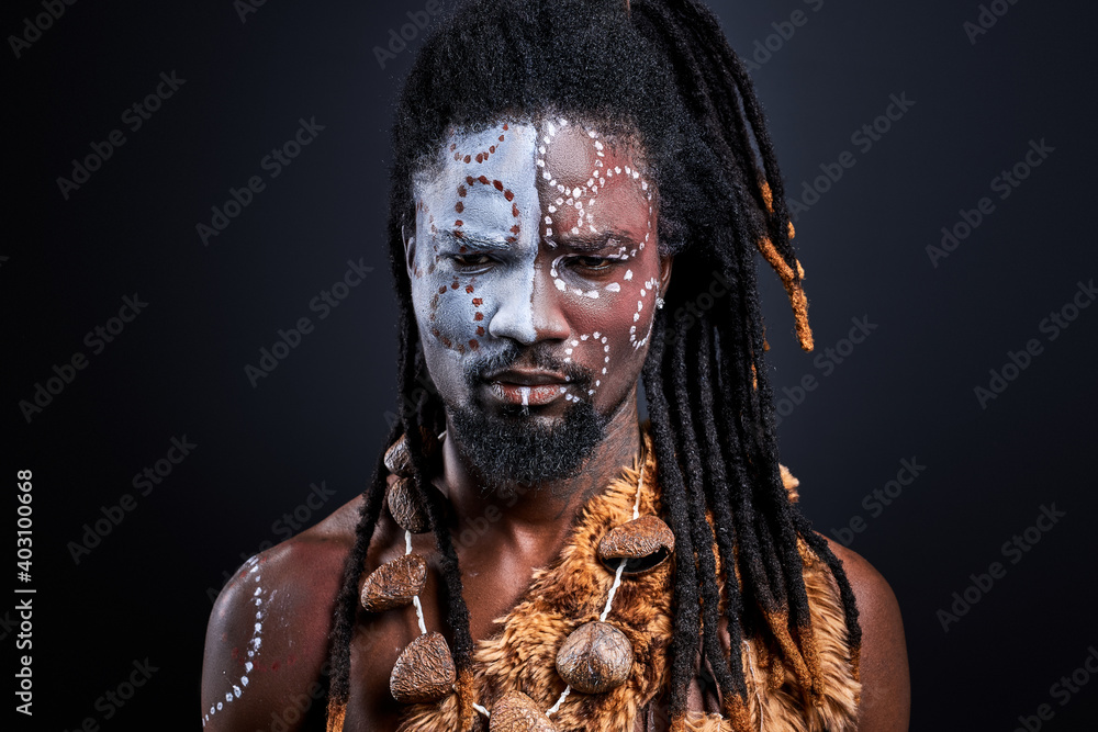 shaman tribal ritual man isolated in studio, exotic aborigen with ...