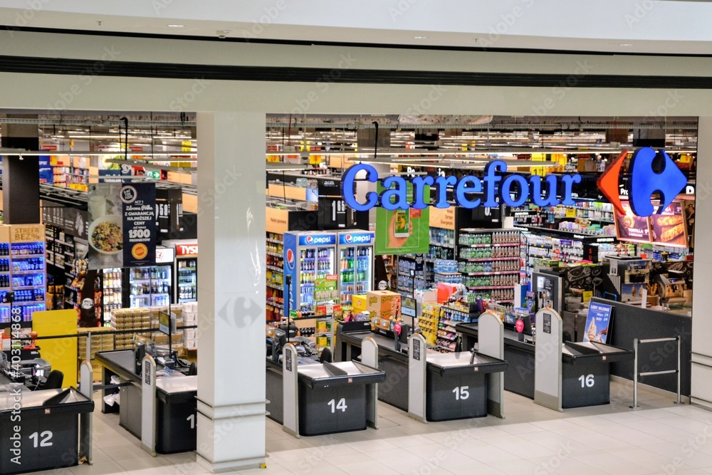 Foto de The interior of Carrefour supermarket, cash desks, no people ...