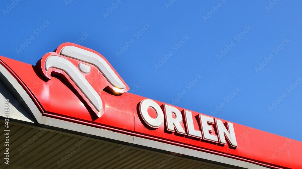 Sign Orlen. Orlen company signboard, logo PKN Orlen - major Polish oil ... Sign Orlen. Orlen company signboard, logo PKN Orlen - major Polish oil ...