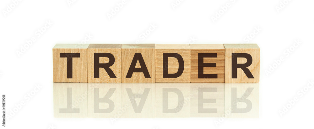 Wooden blocks with the text: trader. The text is written in black ...