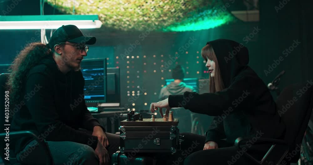 A group of hackers organizes an attack on data servers. Their hideout ...