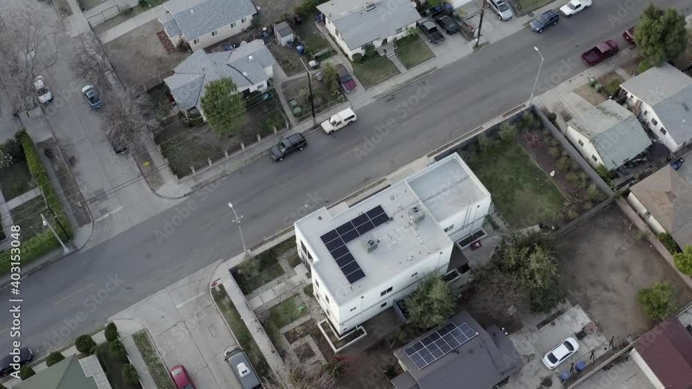 Rising aerial view above American suburban residential building with ...