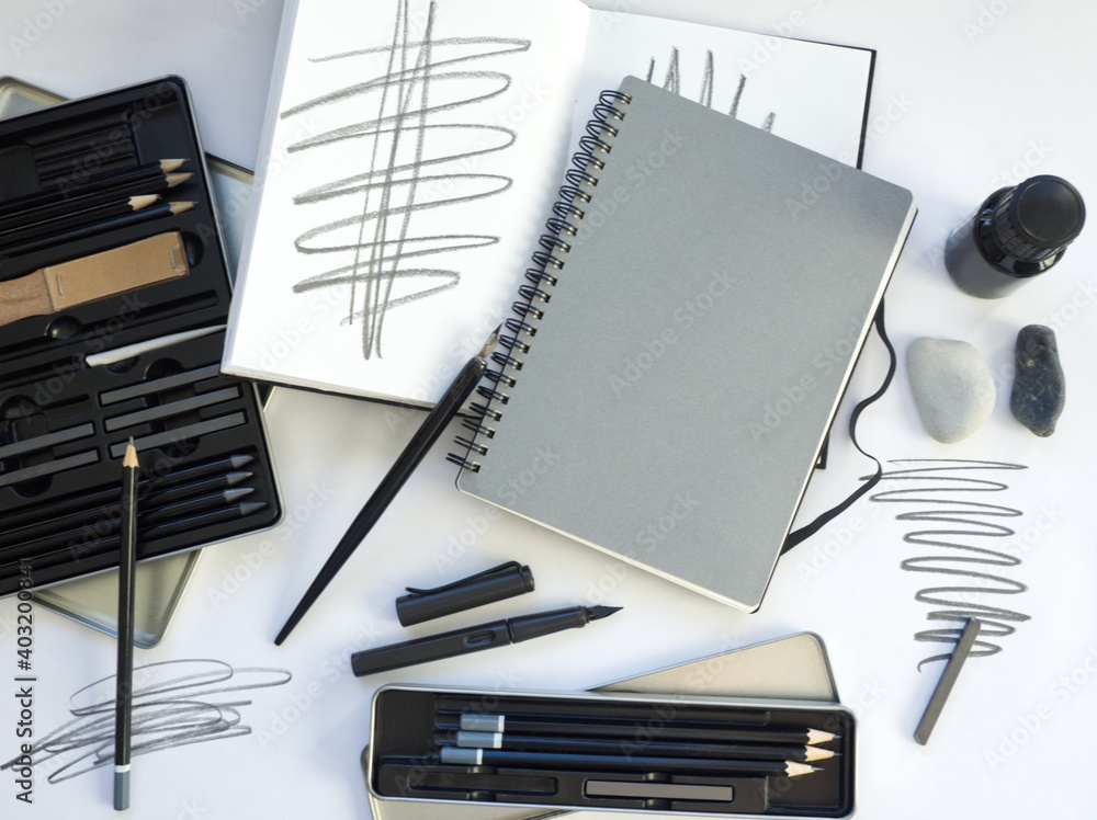 Gray spiral notebook mock up for sketch, artwork or logo design. Desk ...