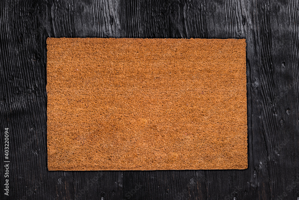 Natural coir doormat on antique wooden texture, background Stock Photo ...