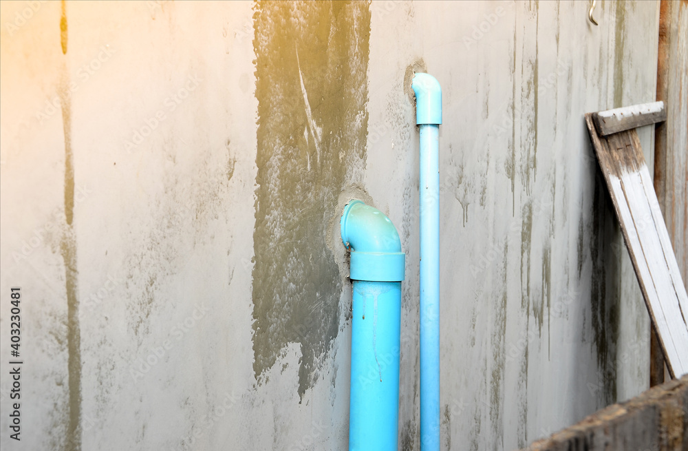 PVC pipes for water delivery, used inside the building, penetrate all ...
