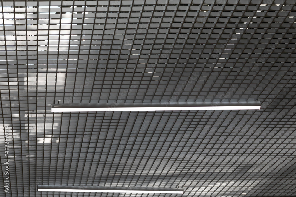 LED lighting lamp on the ceiling of an commercial building. Grid ...
