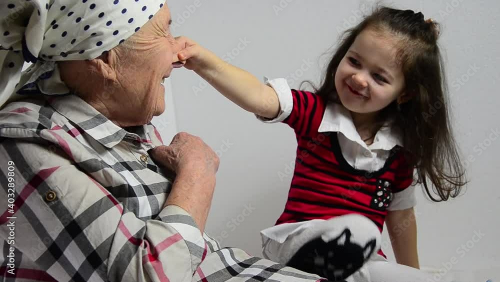 Caring, happy family.Grandmother in the circle of a loving family.Happy ...