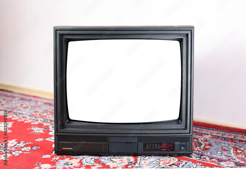 An old vintage TV with a white screen from the 1980s, 1990s, 2000s ...