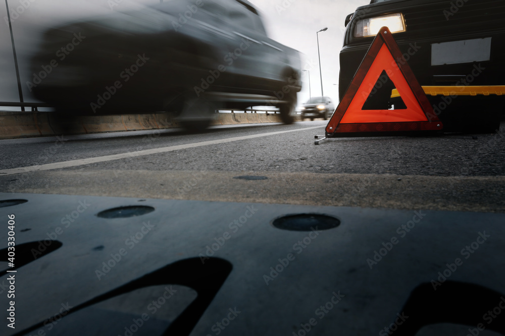 Red emergency stop sign (red triangle warning sign) with broken black ...