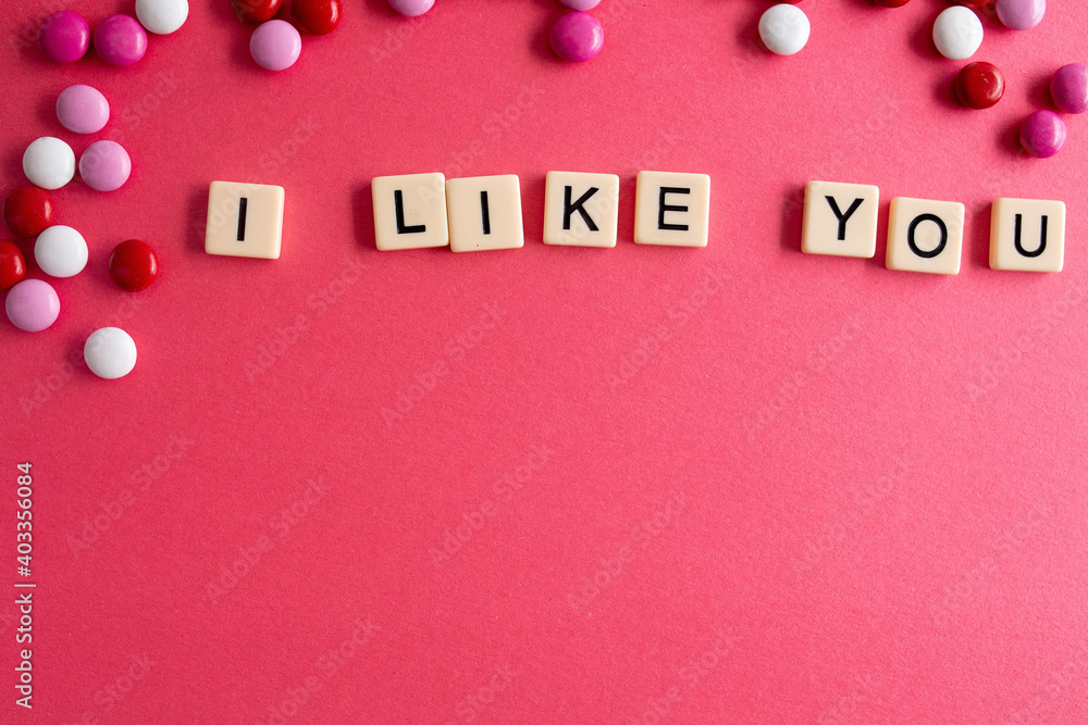 the words i like you written as a flat lay in wood scrabble tiles on a ...