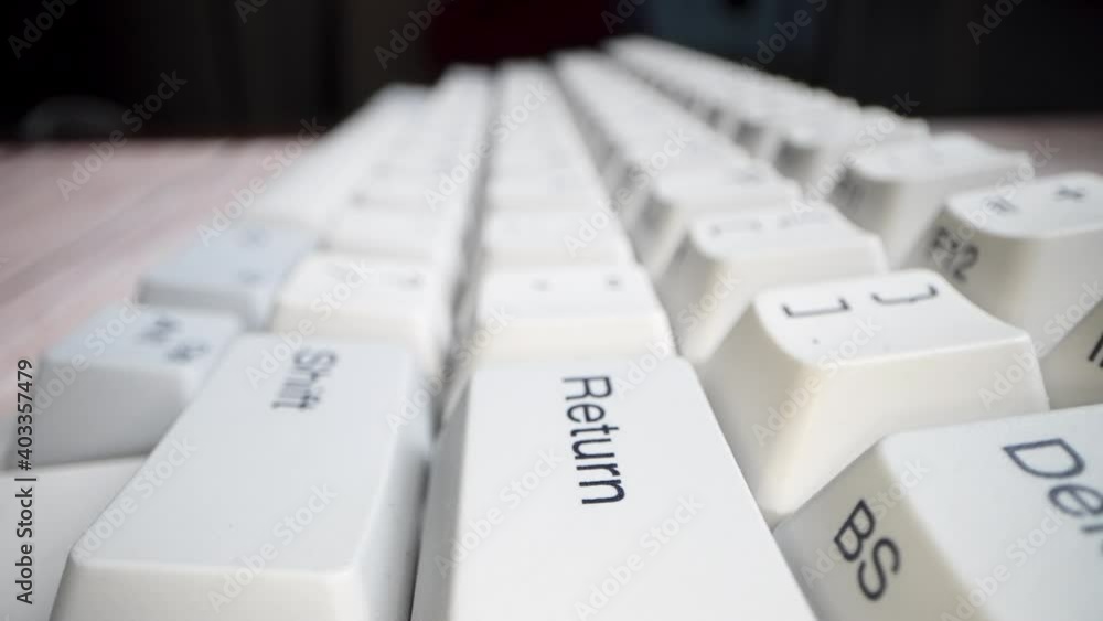 White keyboard keys. Camera movement from left to right. Macro ...