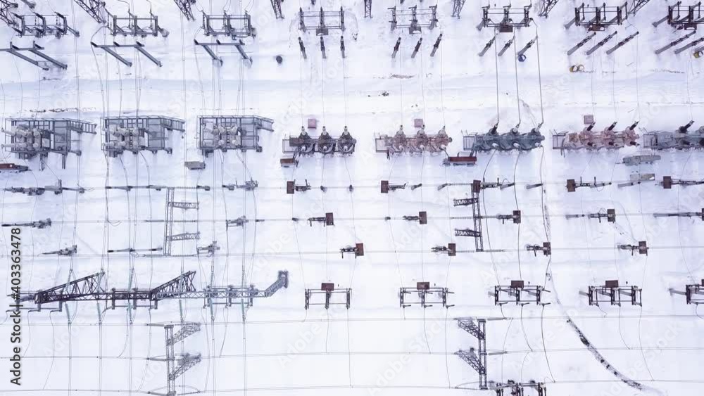 Rows of electric poles. Action. Top view of electrical substation with ...