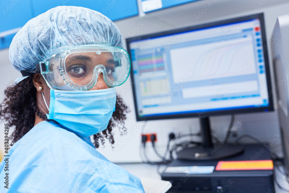 African woman as a researcher in the laboratory at the computer Stock ...