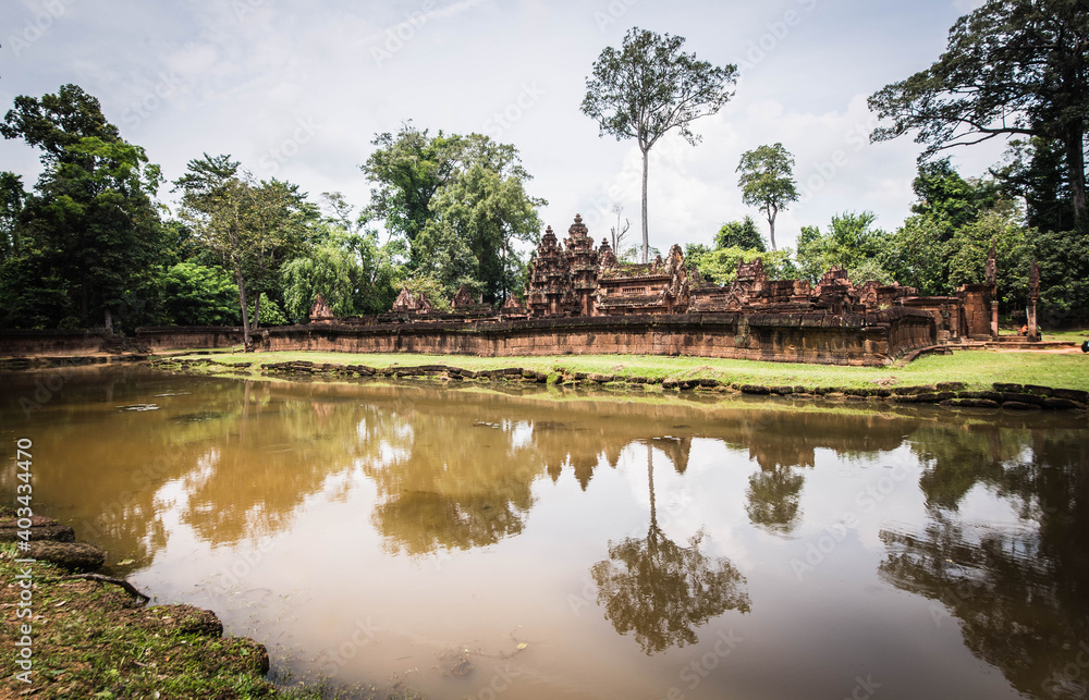 The pond surrounding the ancient pink sandstone castle is called Baray ...