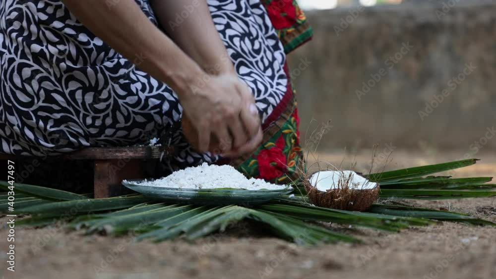 Woman hand grating fresh raw coconut cut open in half 4K slow motion ...