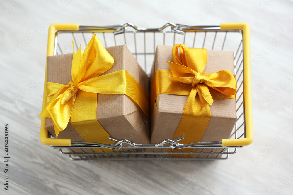 Two gift boxes wrapped by kraft brown paper with beautiful yellow satin ...