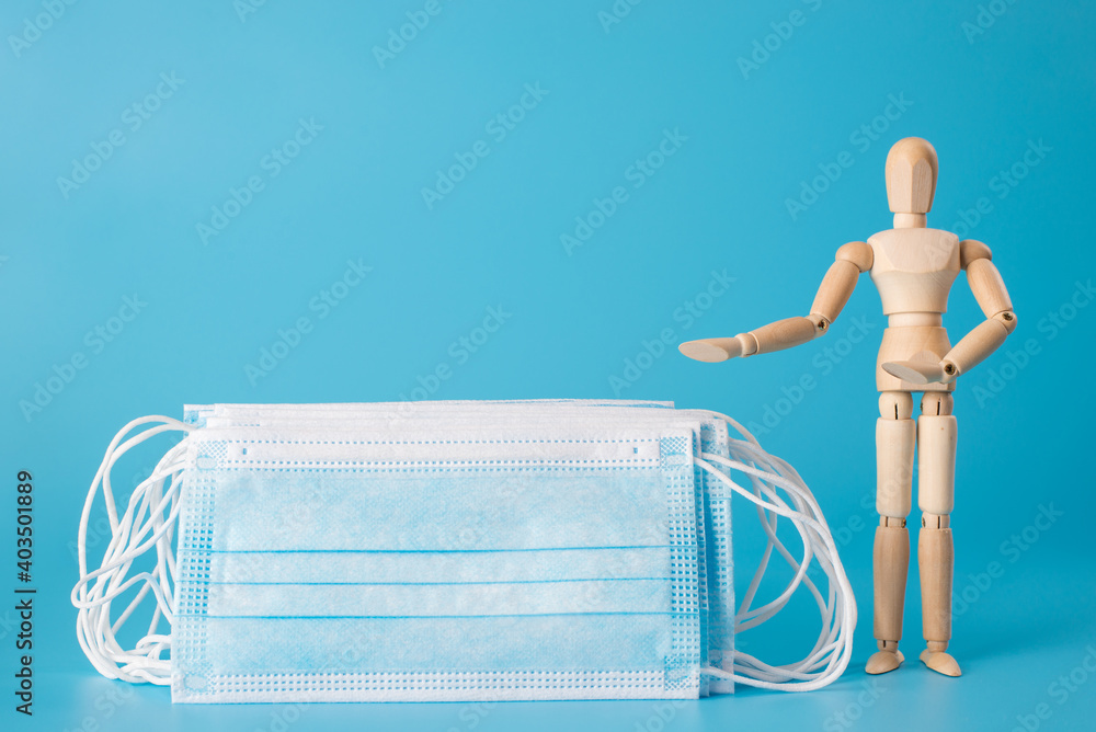 New normal life concept. Photo of wooden human showing on filter mask ...