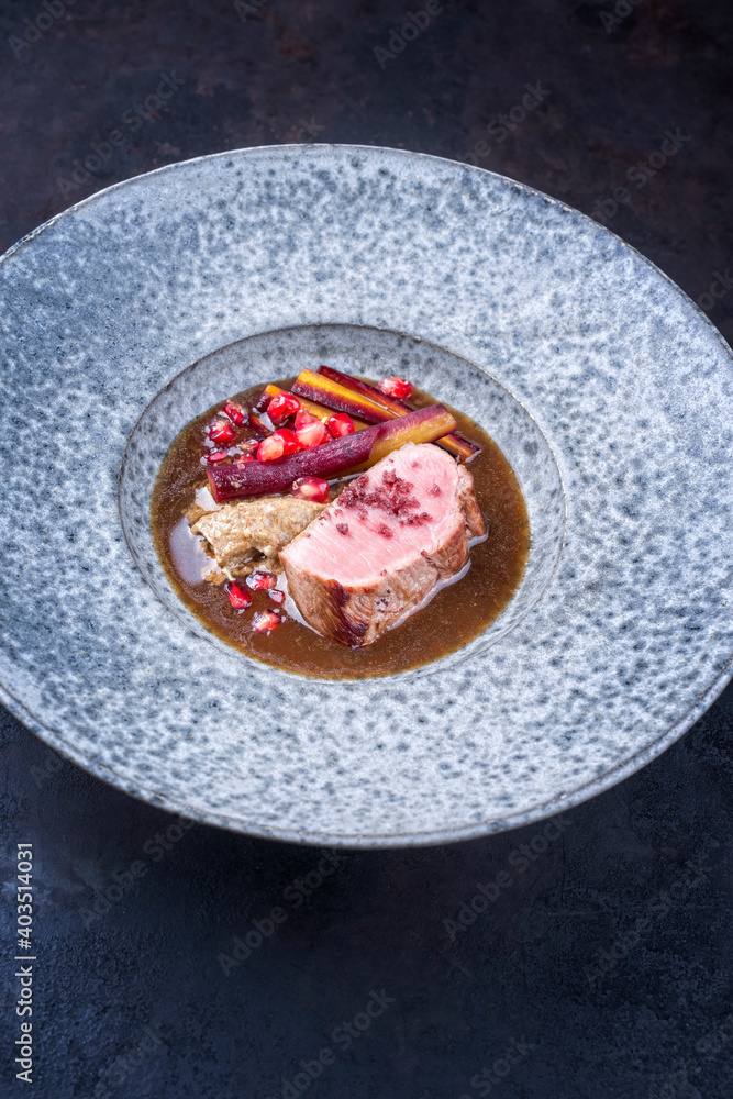 Modern style traditional roasted dry aged veal tenderloin with porcini ...