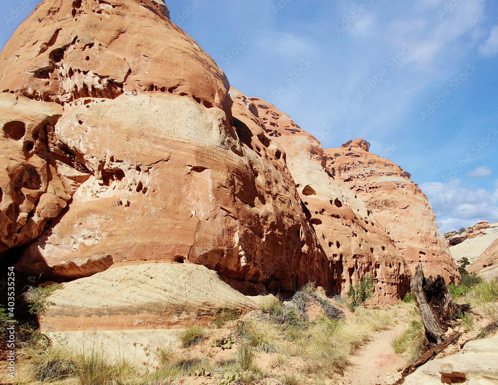 Golden sandstone geographical formations with a desert prairie ...