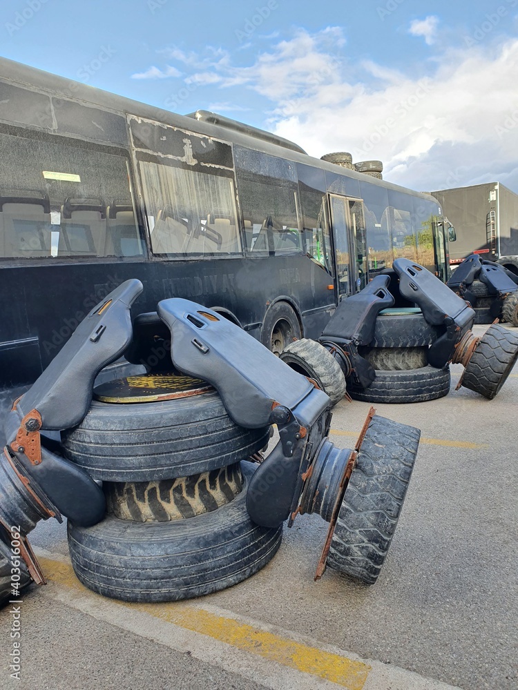 Old bus seats and wheels used as industrial tables on a restaurant ...