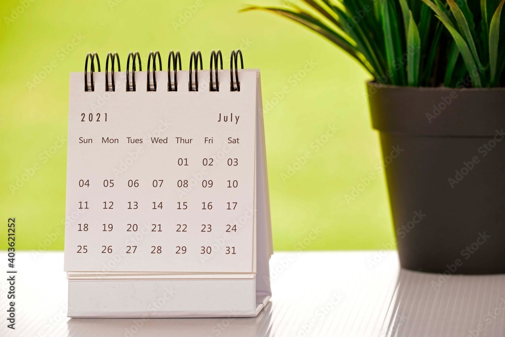 White July 2021 calendar with green backgrounds and potted plant Stock ...