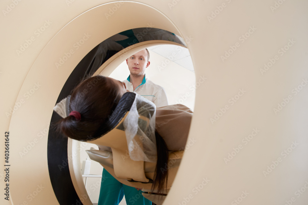 Female patient undergoing MRI - Magnetic resonance imaging in Hospital ...