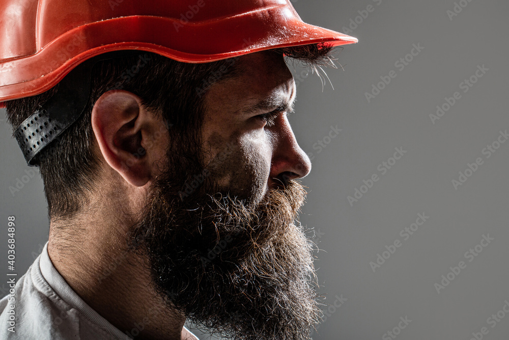 Building, industry, technology - builder concept. Bearded man worker ...