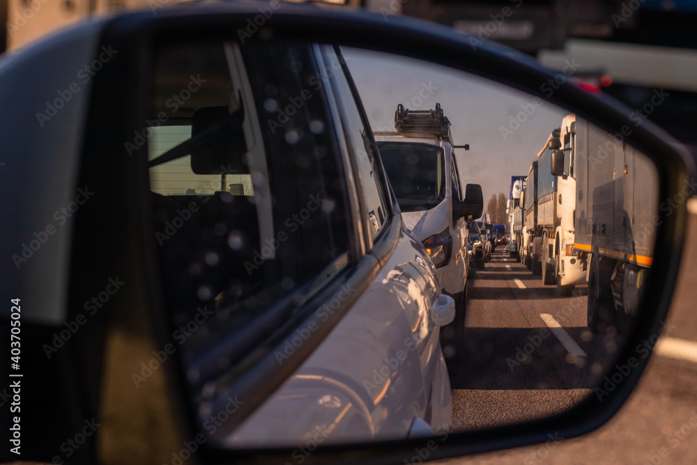 Long queue of trucks and cars as part of a traffic jam on a motorway in ...