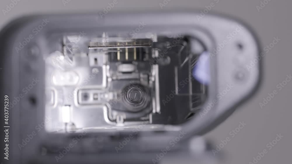 Extreme close up of an empty slot for the battery of a photo and video ...