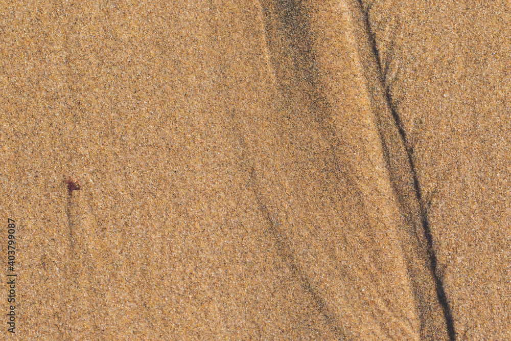 Extreme macro close up of fine beach sand surface pattern in the summer ...