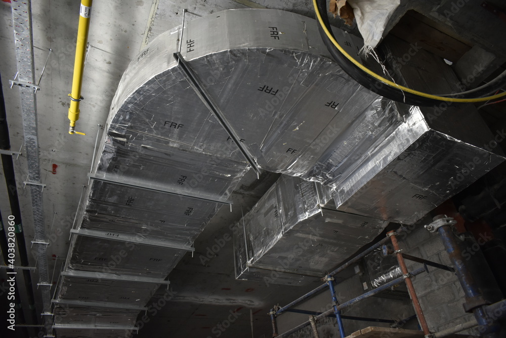 MEP works in civil construction site. Aluminum fabricated air flow duct ...