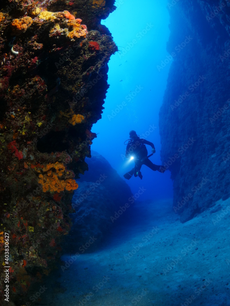 scuba divers exploring the reefs and rocks ocean scenery topography ...
