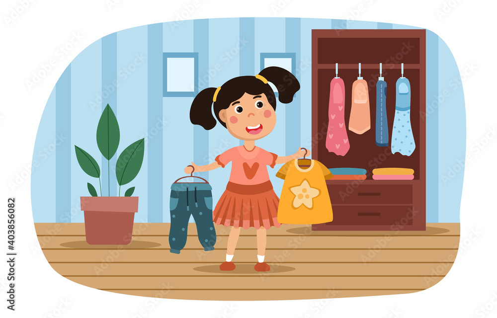 Young girl choosing an outfit of clothes from the closet holding a pair ...
