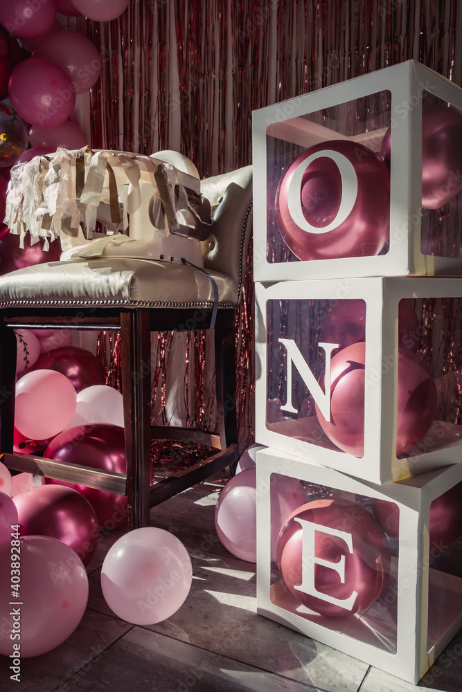 Vertical shot of transparent containers with balloons stack on each ...