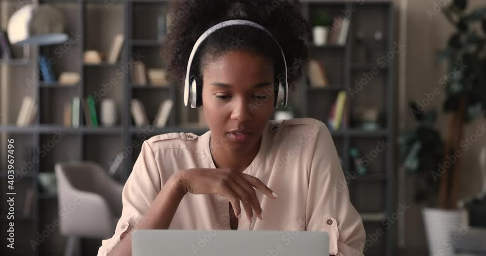 African student communicates with mate by video call app on laptop ...