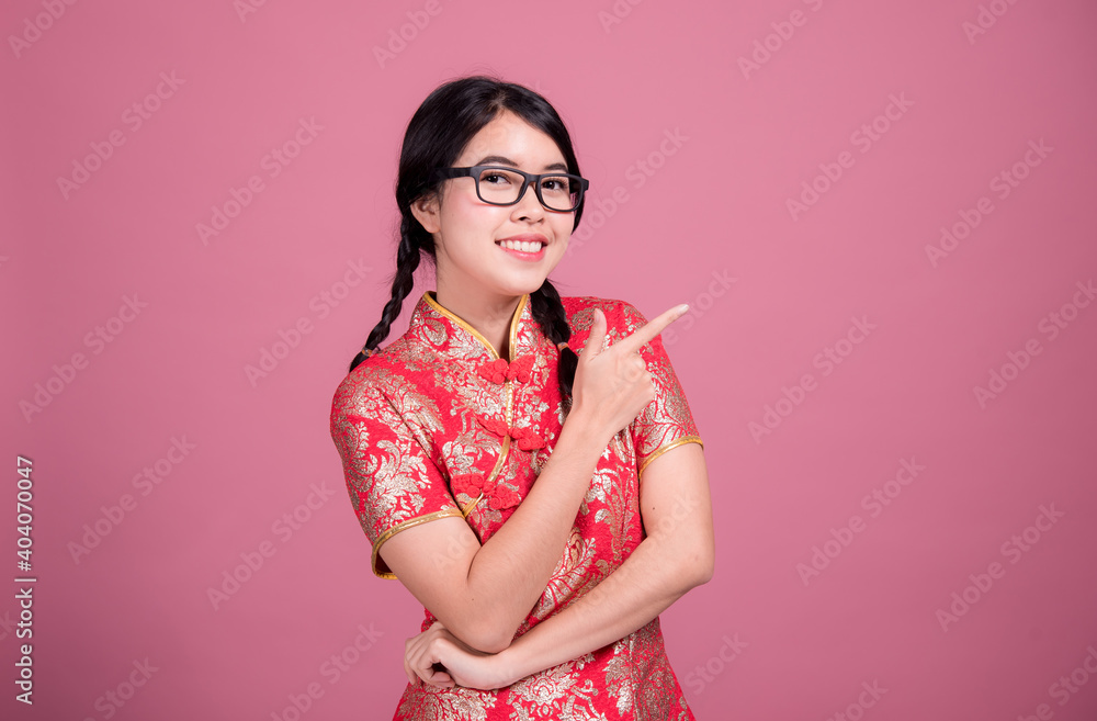 Action portrait beautiful Asian girl wearing Cheongsam red dress. the ...