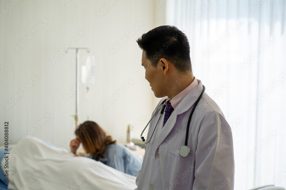 Asian medical doctor wearing white gown stethoscope standing with death ...