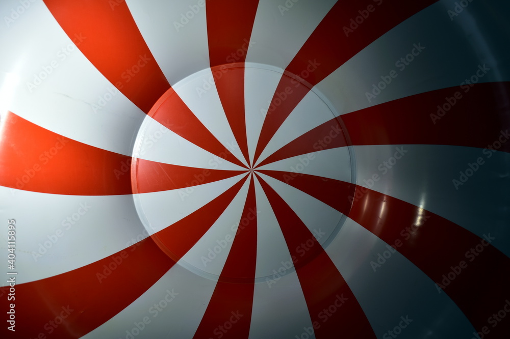 red lines on the plastic surface converge at the center of the circle ...