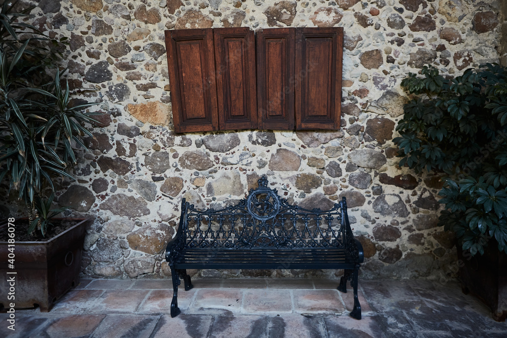 rustic place where you can see a metal bench painted green and above is ...