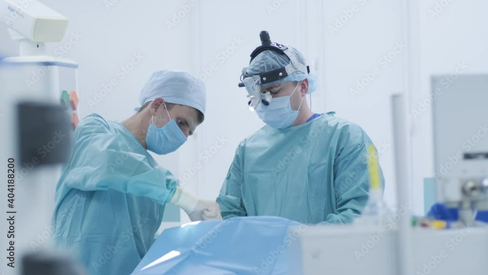 Operation of removing tonsils, tonsillectomy under deep anesthesia ...