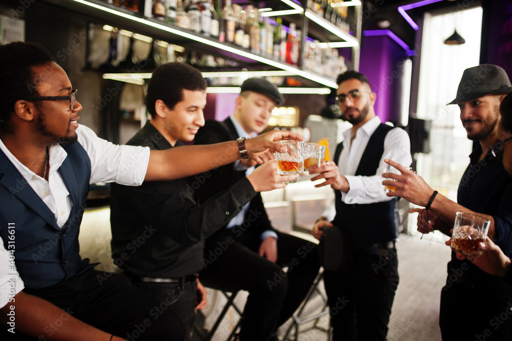 Cheers! Group of handsome retro well-dressed man gangsters spend time ...
