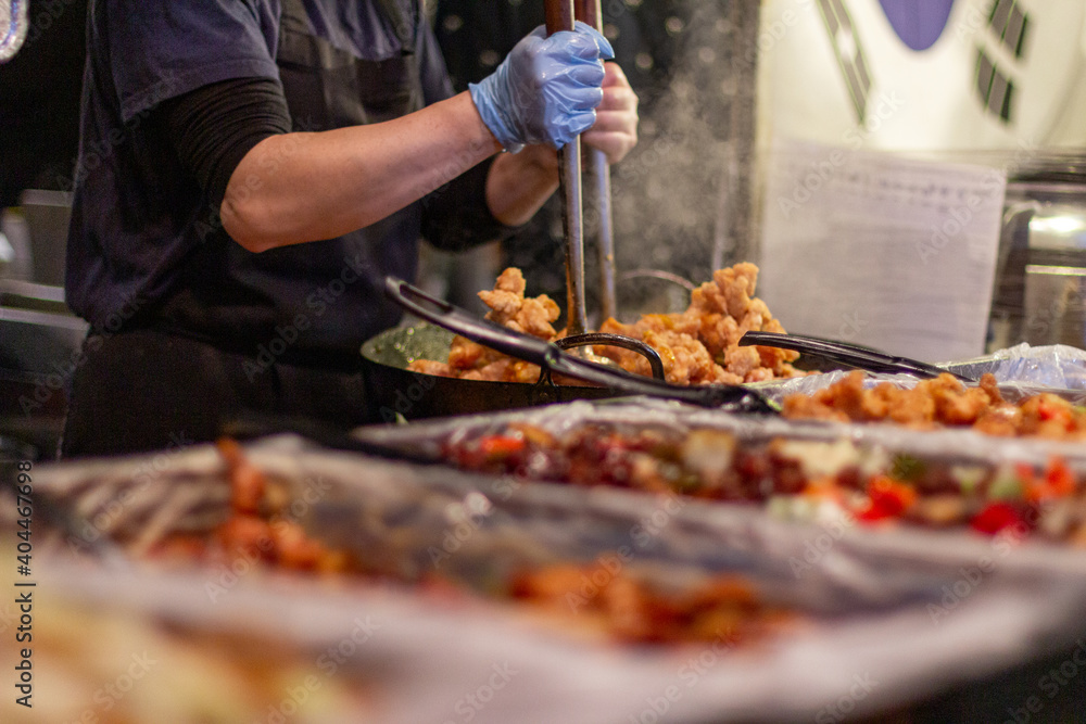Hands of a person with a ready to eat food box or tasting in a brown ...