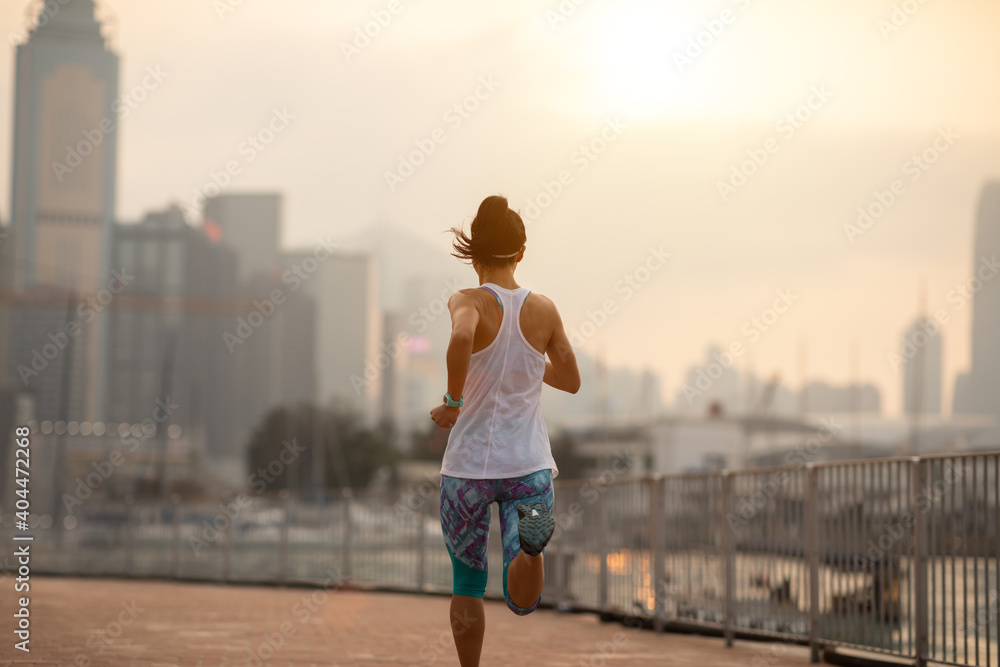 Healthy lifestyle woman runner running on hong kong city Stock Photo ...